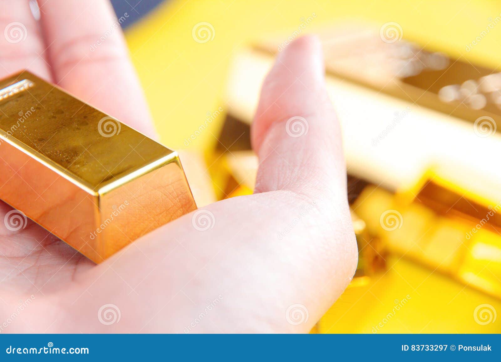 Hand hold gold bars stock image. Image of business, antique - 83733297
