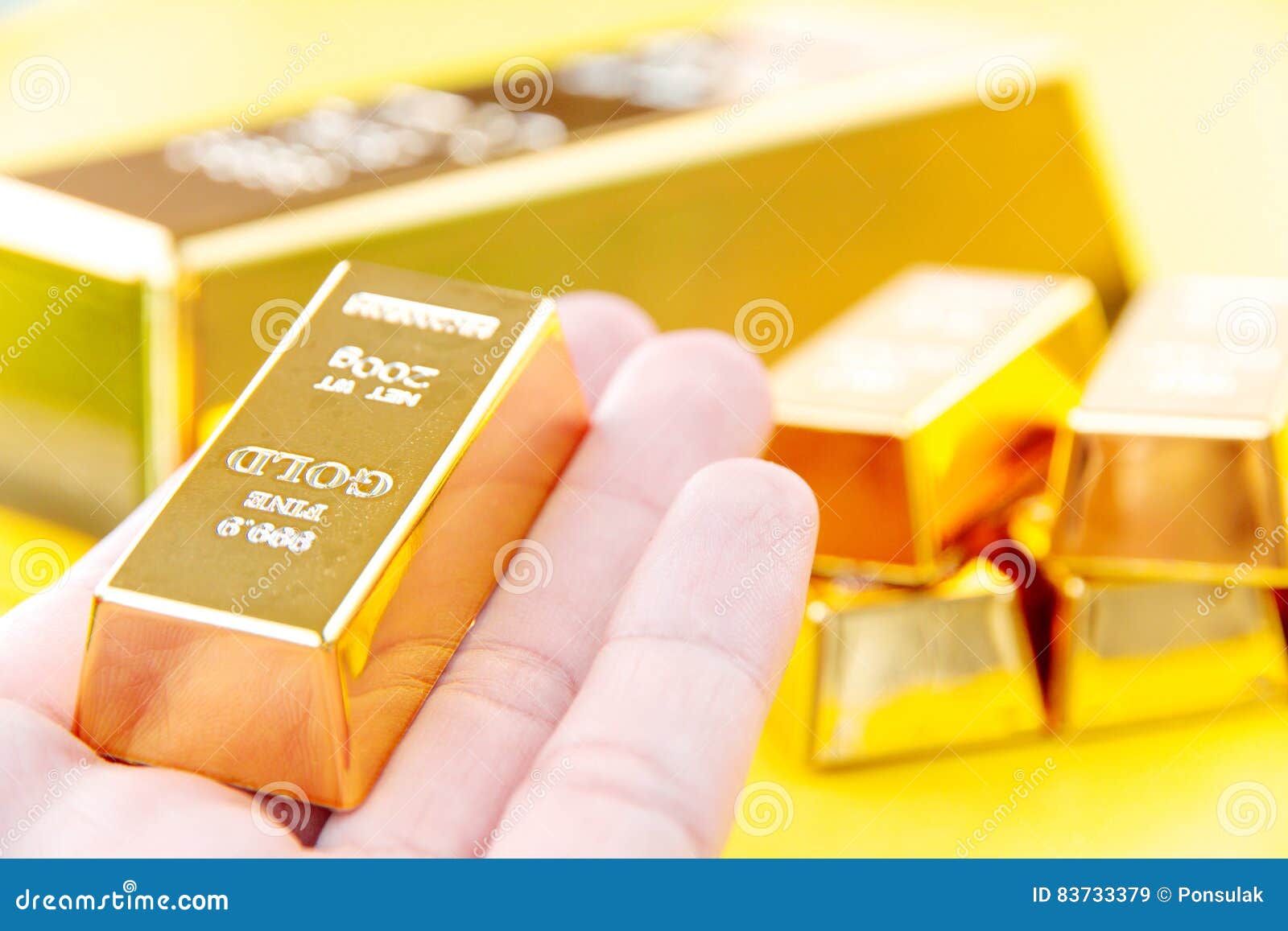 Hand hold gold bars stock image. Image of asian, chinese - 83733379