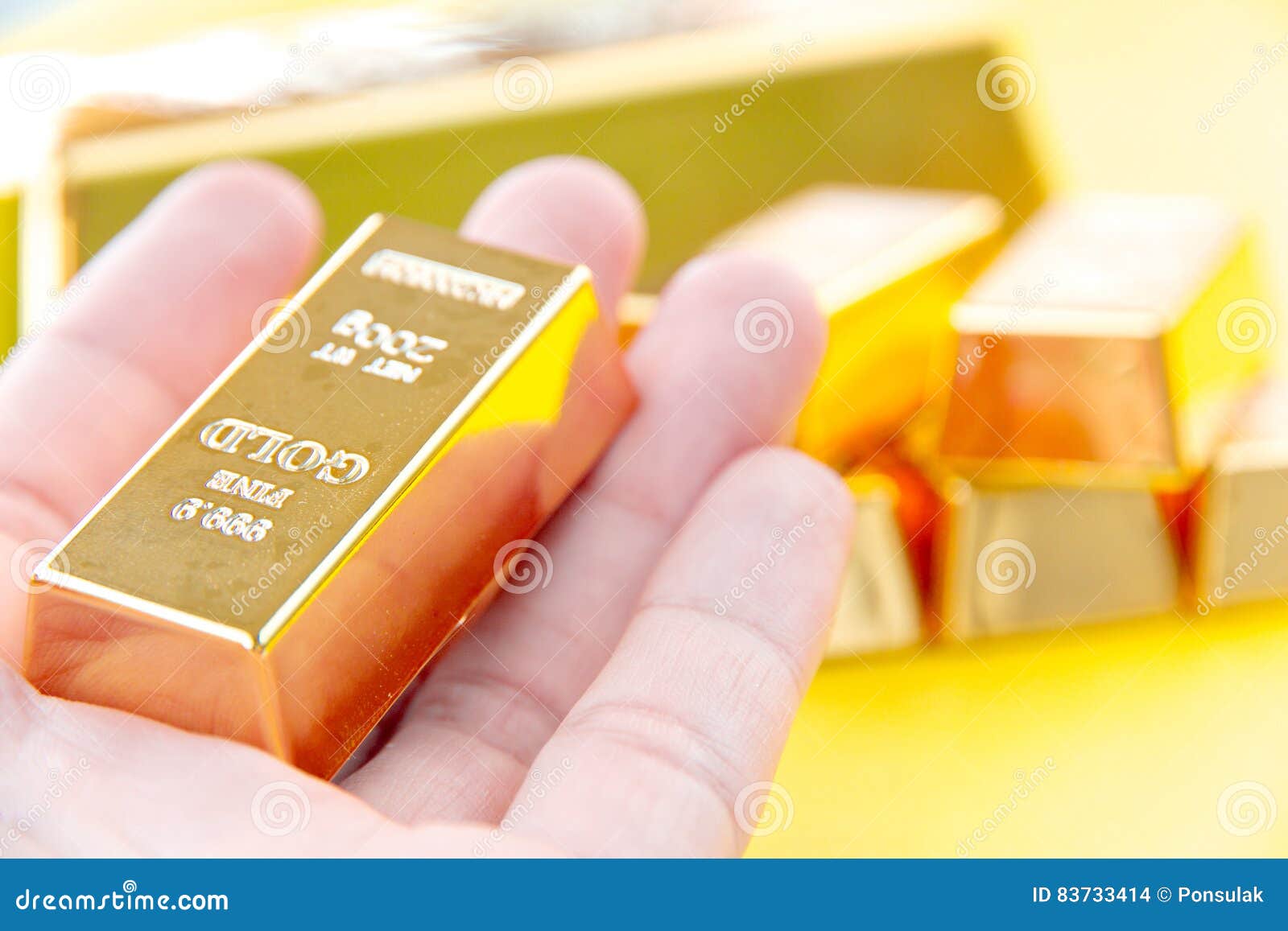 Hand hold gold bars stock photo. Image of abacus, clash - 83733414