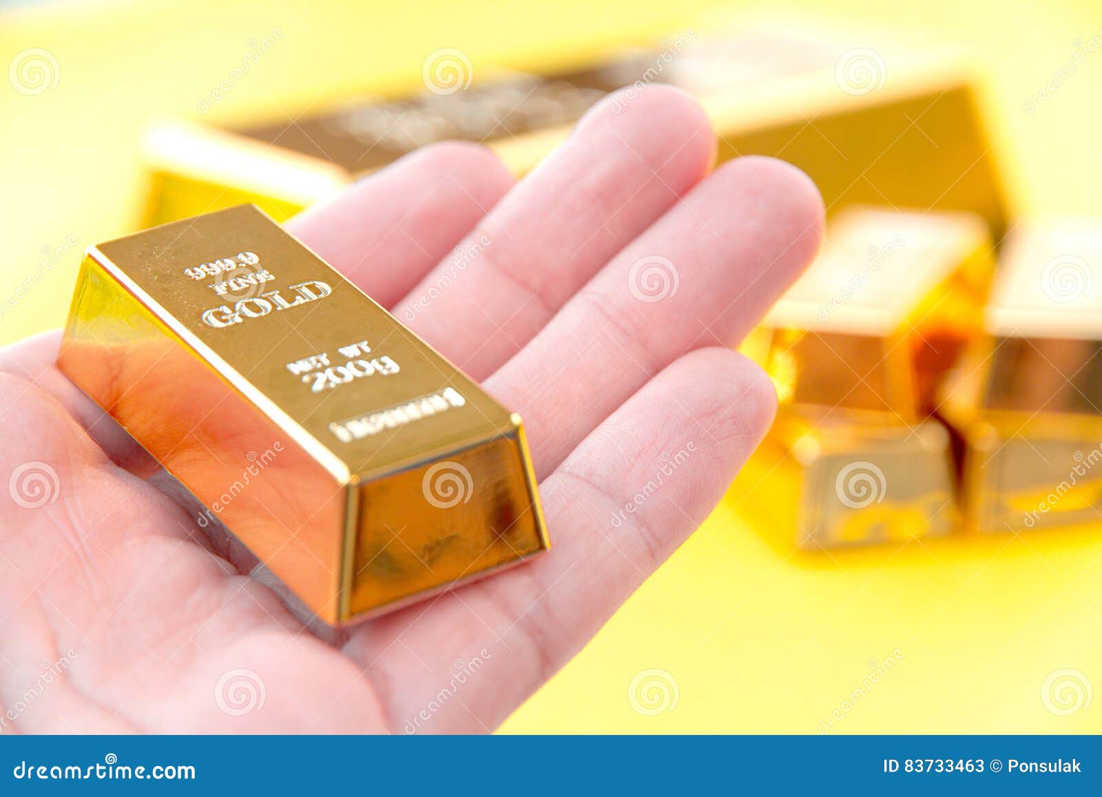 Hand hold gold bars stock image. Image of arithmetical - 83733463