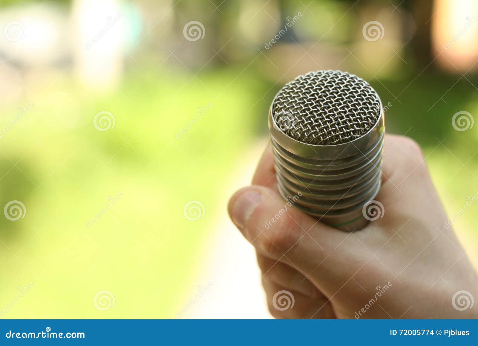 Hand Hold Microphone. Interview in the Park. Stock Photo - Image of ...