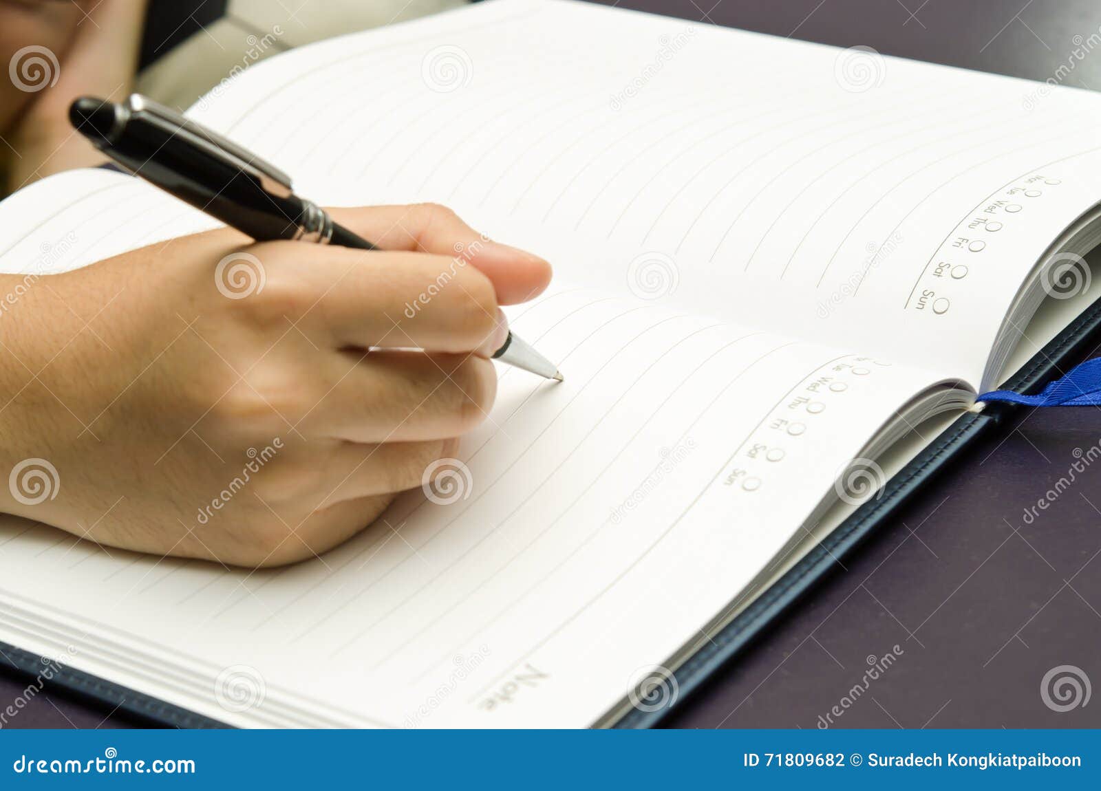 Hand Hold a Pen and Write on a Book Stock Photo - Image of education ...