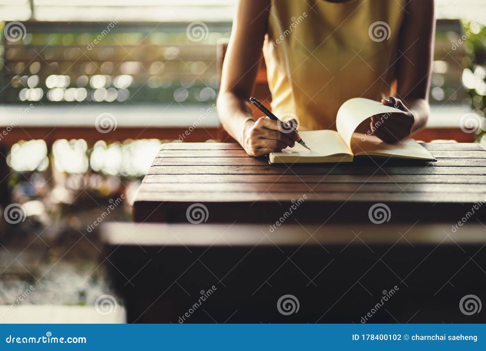 Hand Hold Pen and Writing a Book on the Table Stock Photo - Image of ...