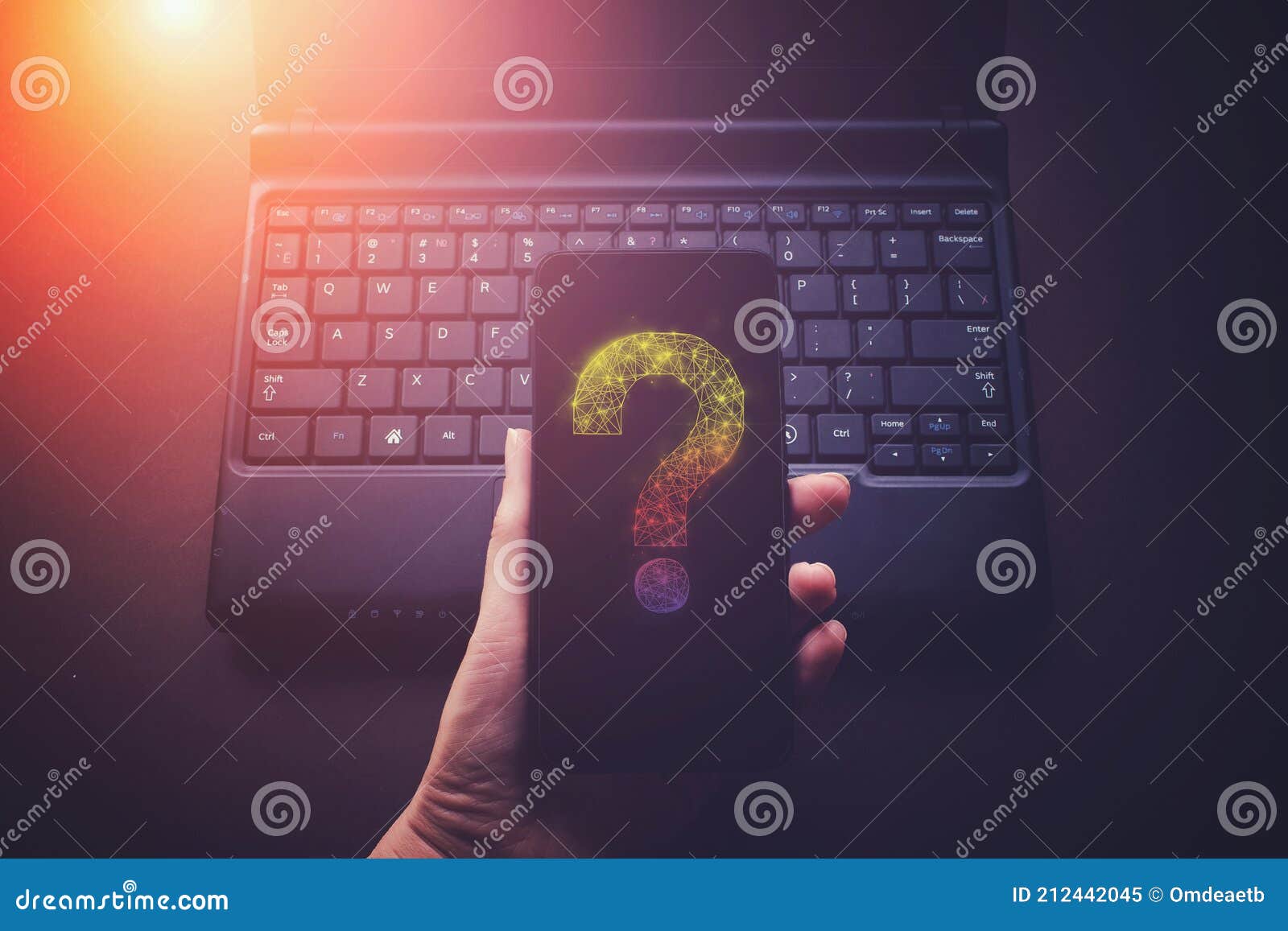 Hand Hold Phone with Virtual Low Poly Hologram Question Mark on Laptop ...