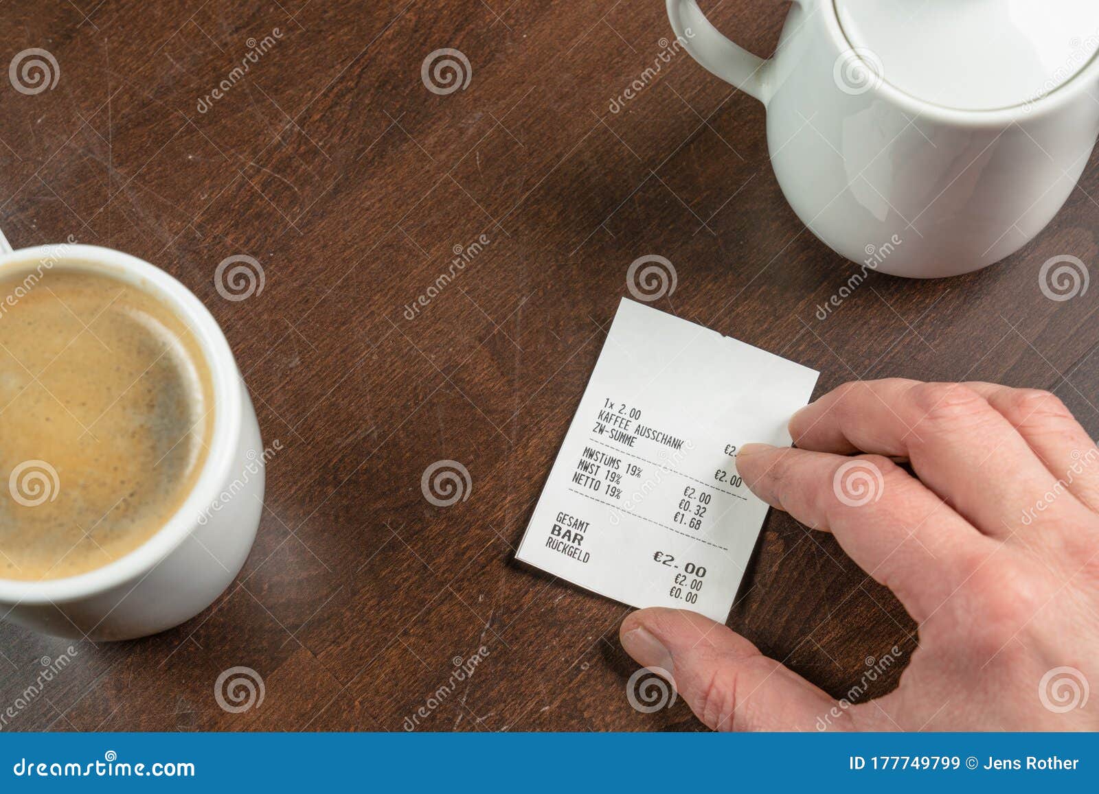 Hand Hold a Receipt on a Wooden Table Stock Image - Image of check ...