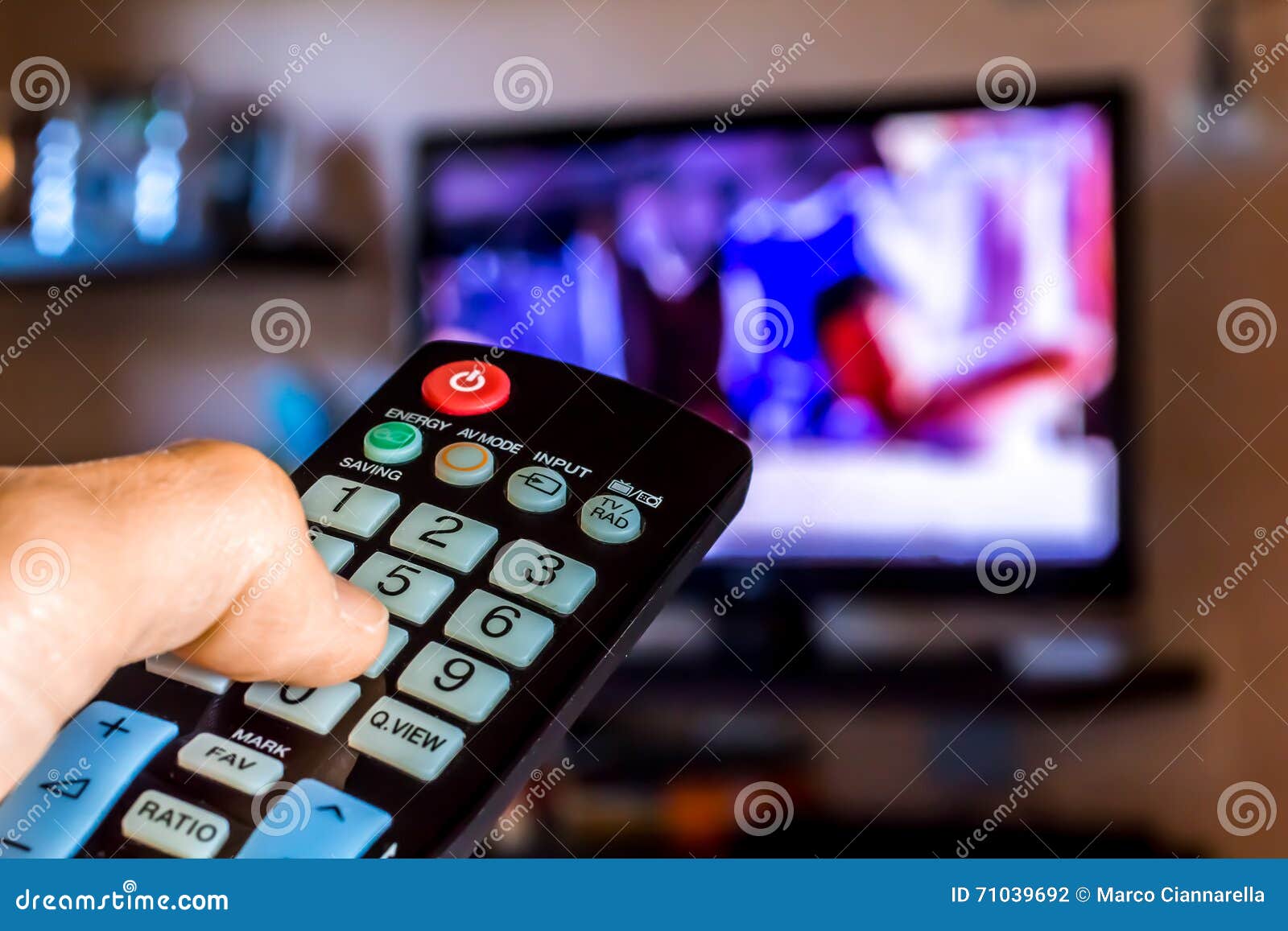 Hand Hold the Remote Control To Change Channesl on Tv Stock Photo ...
