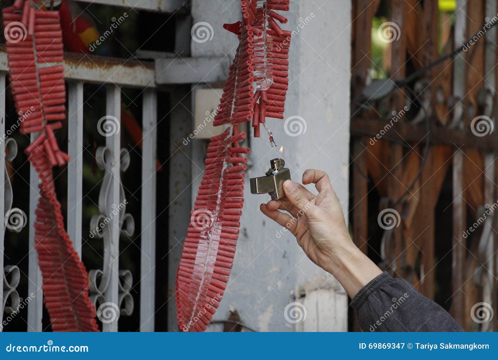 Hand Hold a Silver Lighter and Lighting Fire Cracker Stock Image ...