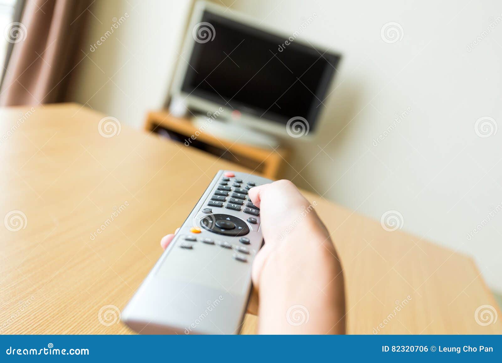 Hand Hold TV Remote Control Stock Photo - Image of black, screen: 82320706