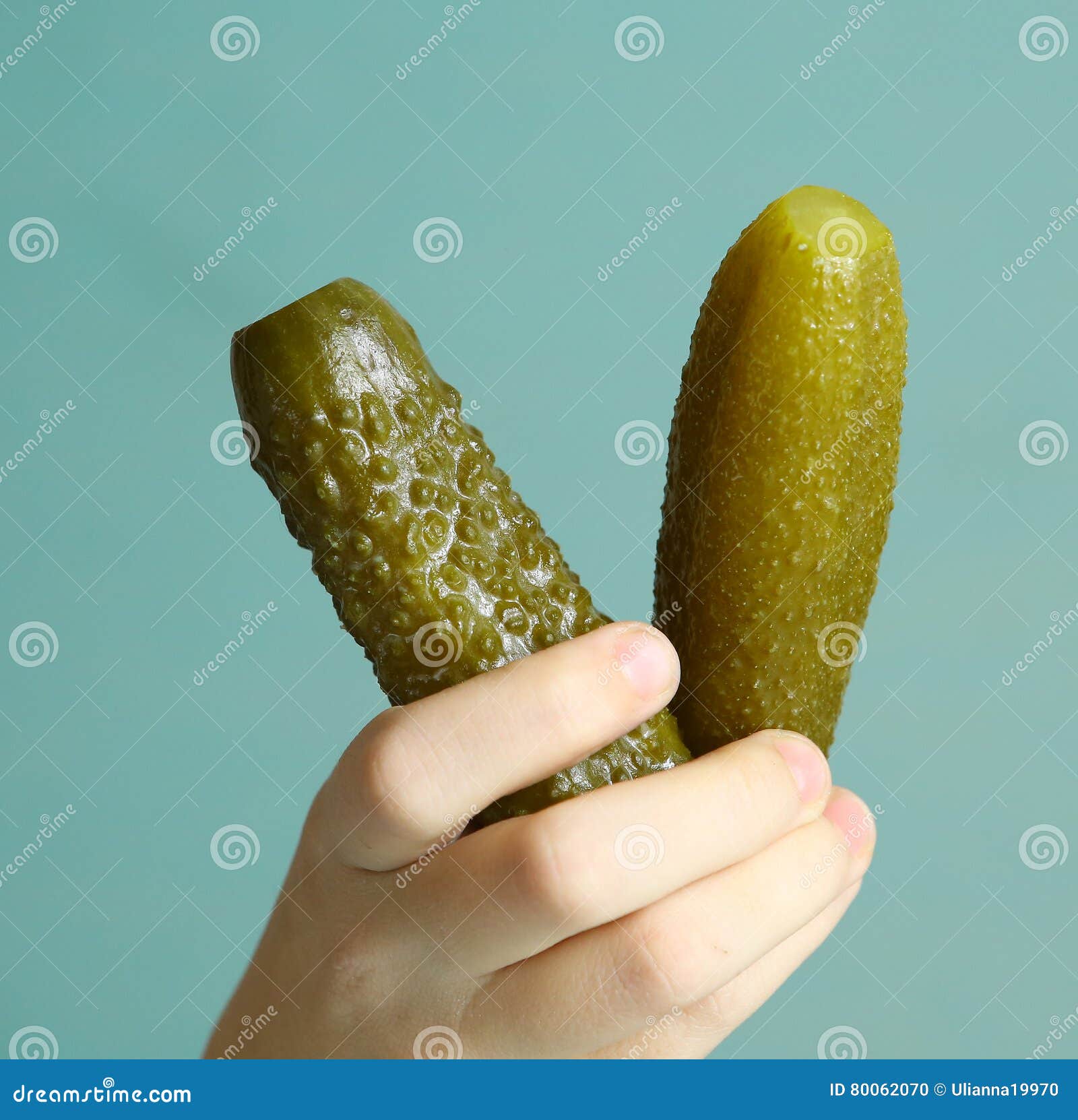 Hand Hold Two Marinated Cucumbers Close Up Stock Photo - Image of ...