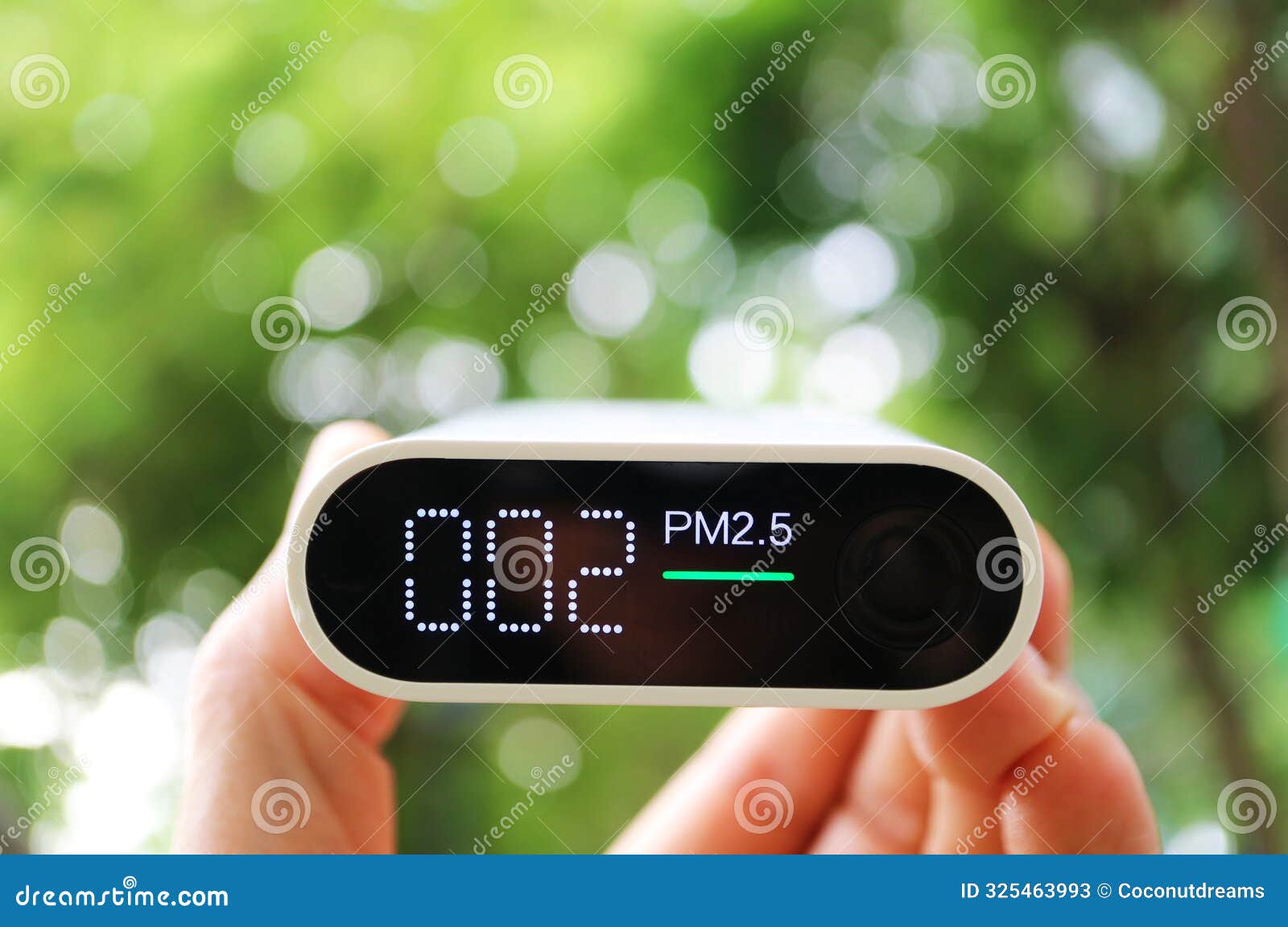 Hand Holding Air Pollution Sensor Measuring Air Quality in the Garden ...