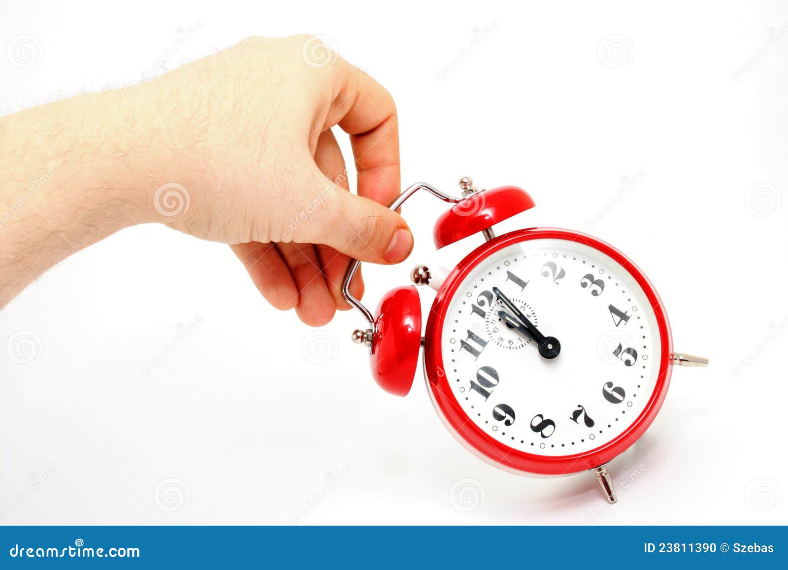 Hand holding alarm clock stock photo. Image of holding - 23811390