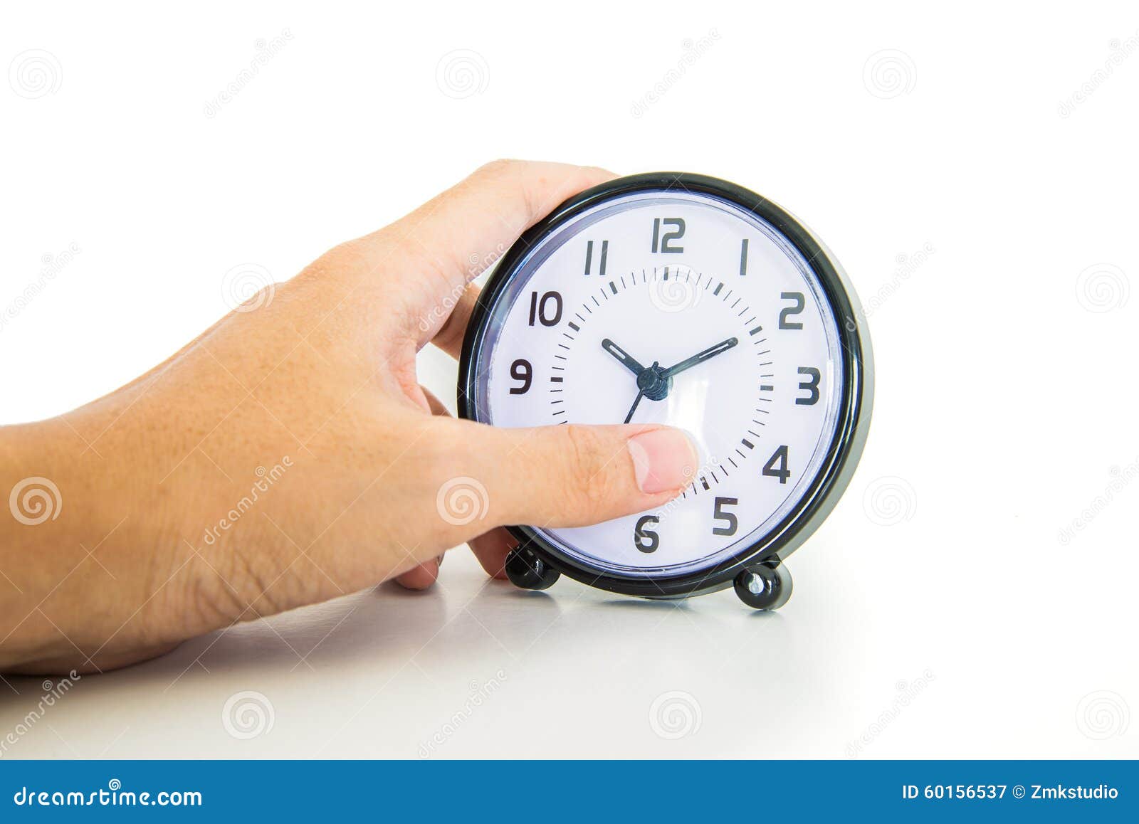 Hand holding alarm clock stock image. Image of people - 60156537