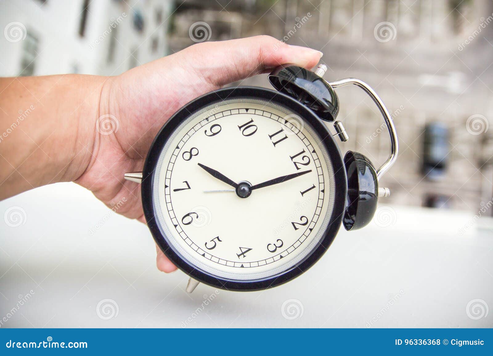 Hand holding Alarm clock stock photo. Image of counting - 96336368
