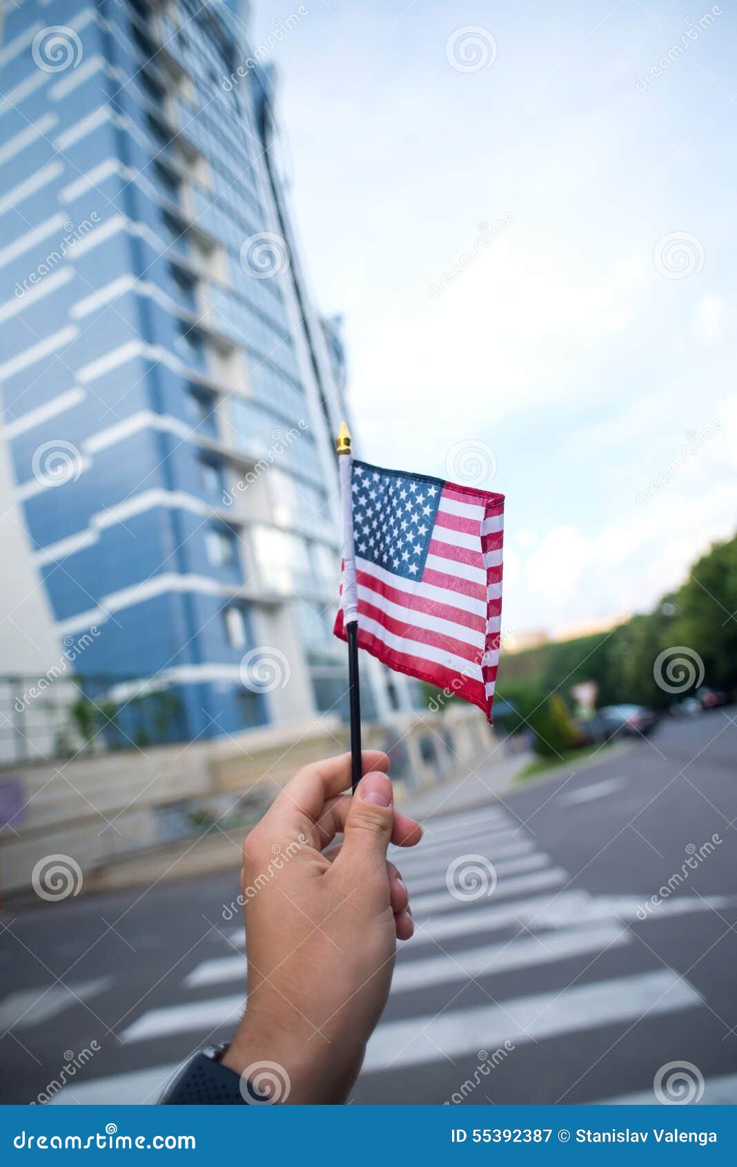 Hand holding american flag stock image. Image of american - 55392387