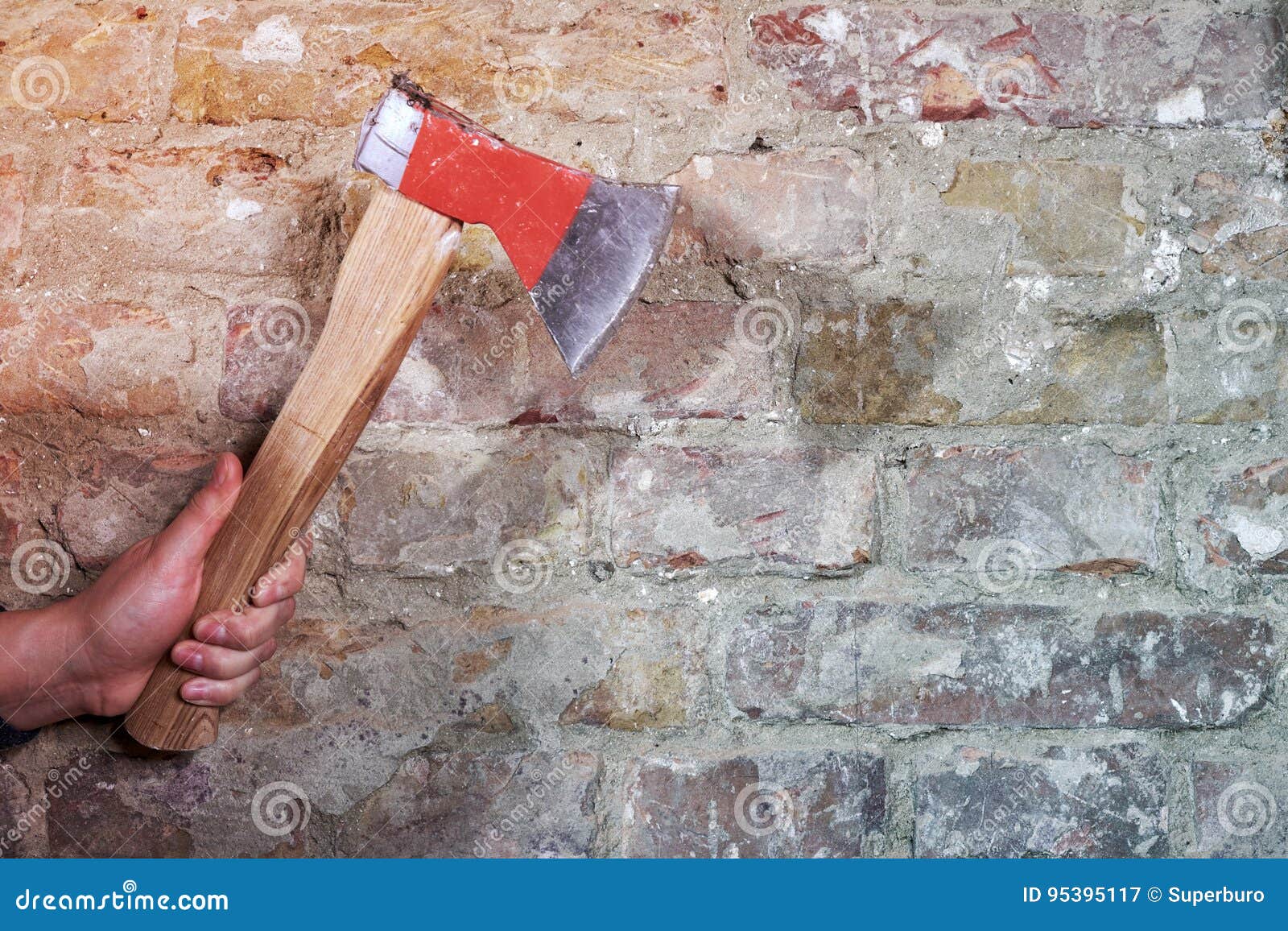 Hand Holding Axe Against Brick Wall Stock Image - Image of brickwork ...