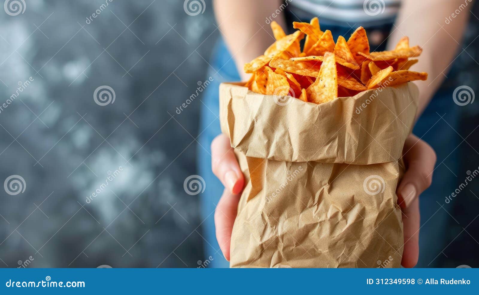 Hand Holding a Bag of Nacho Tortilla Chips, Snacking Concept. Stock ...