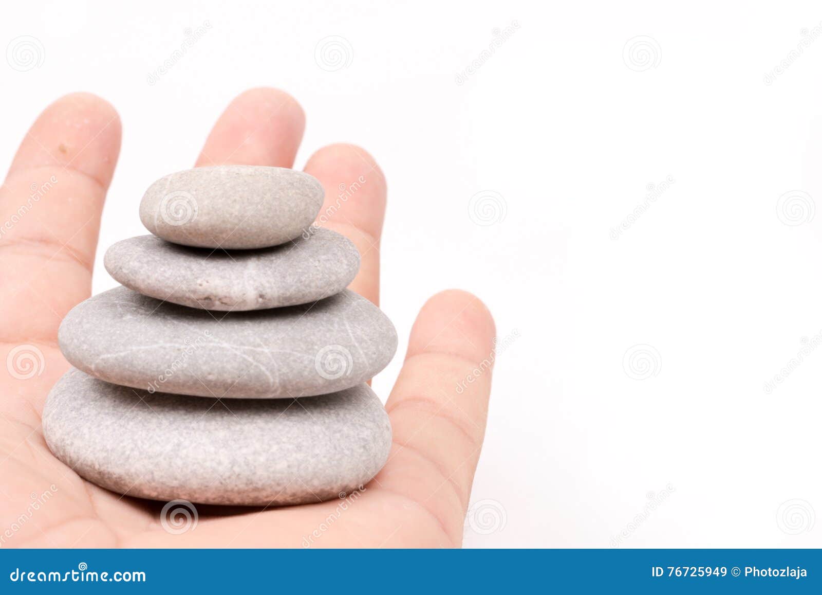 Hand Holding Balanced Grey Stones Over White Background Stock Image ...