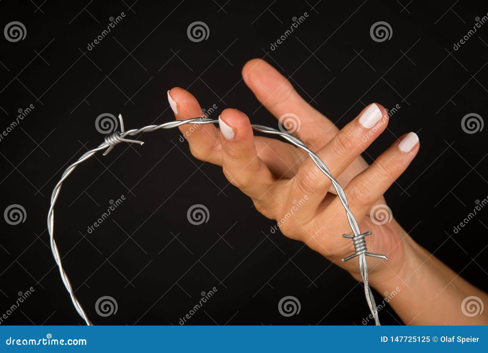 Hand holding barbed wire stock image. Image of refugee - 147725125