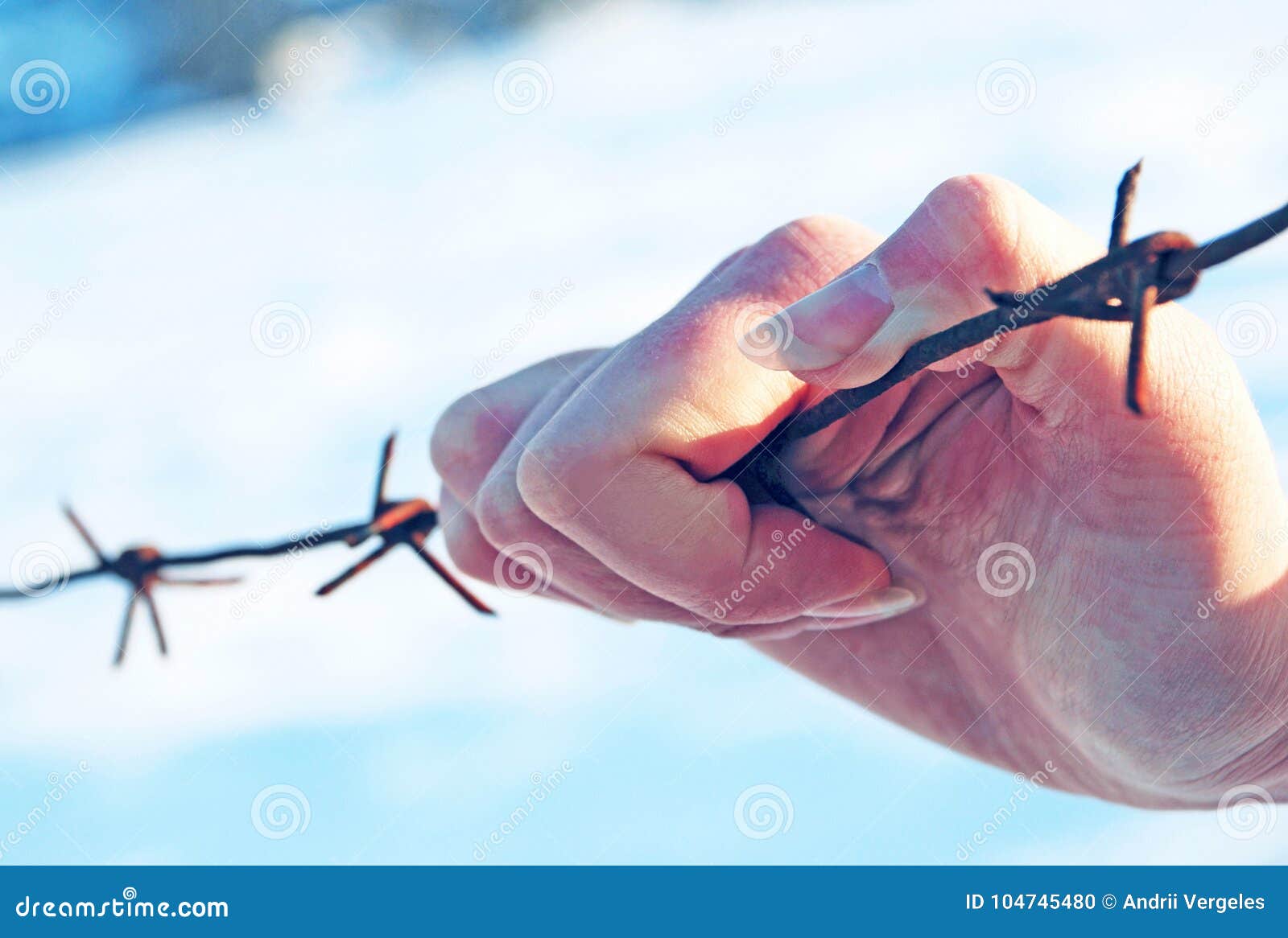 Hand holding a barbed wire stock photo. Image of religion - 104745480