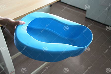 Hand holding bedpan stock image. Image of help, assist - 2499071