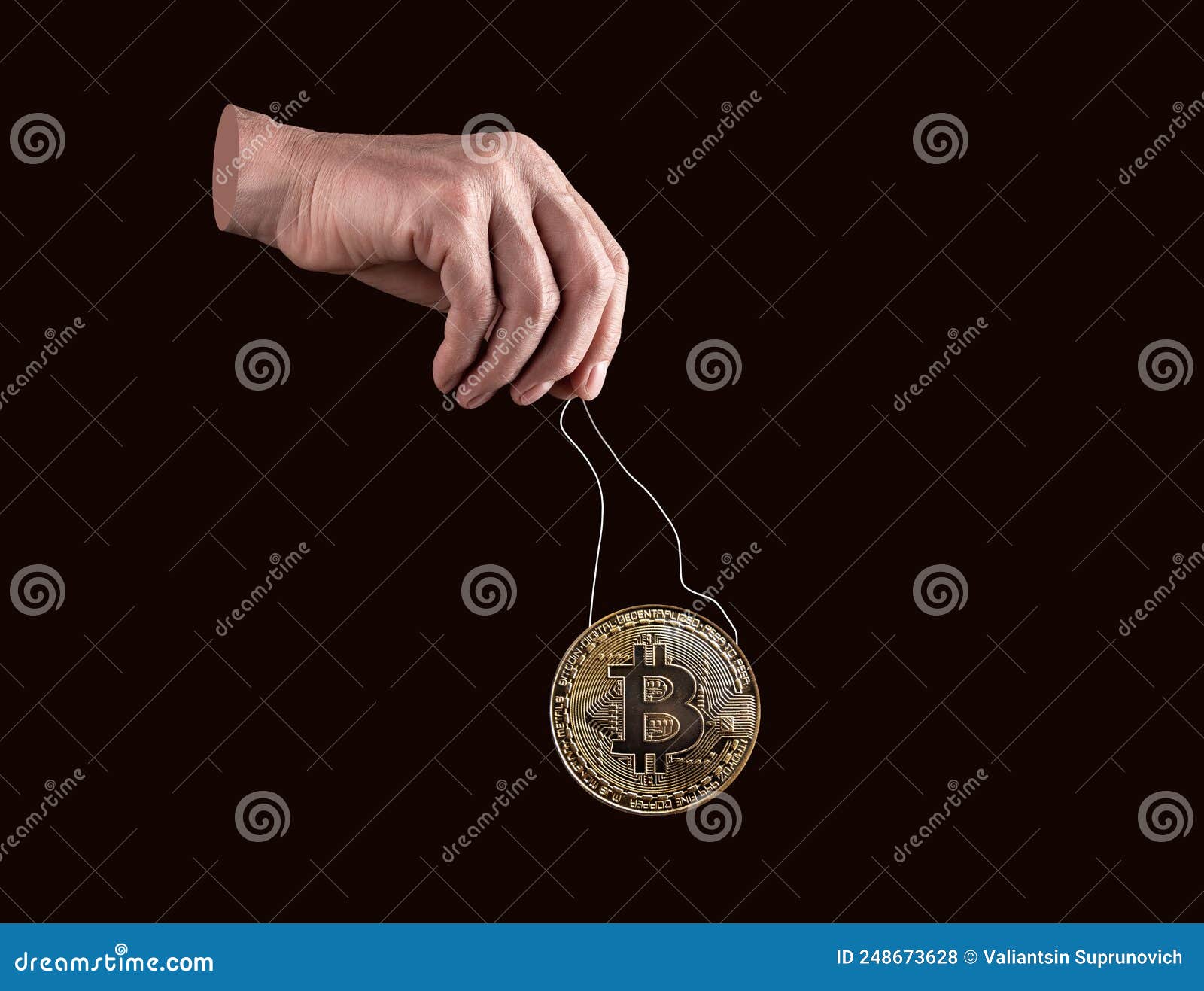 Hand Holding Bitcoin Coin by Strings. Manipulation in Cryptocurrency ...