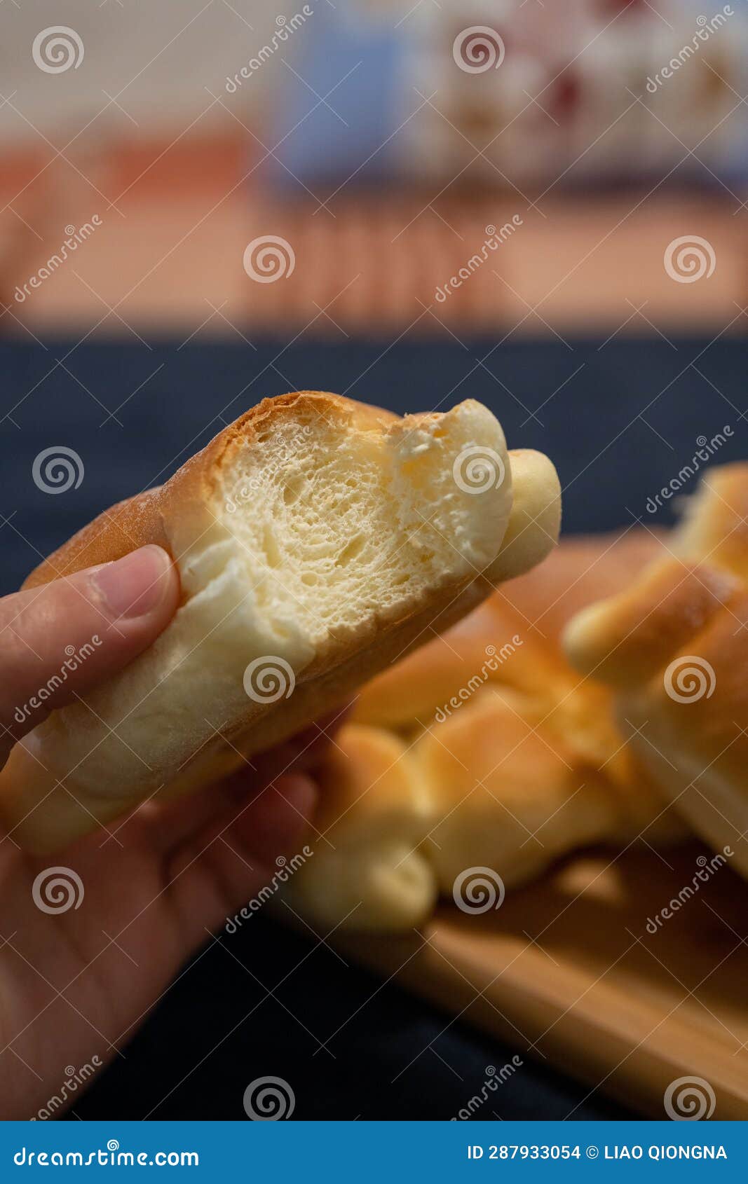 The Hand is Holding a Bitten Bread. Stock Photo - Image of baked ...