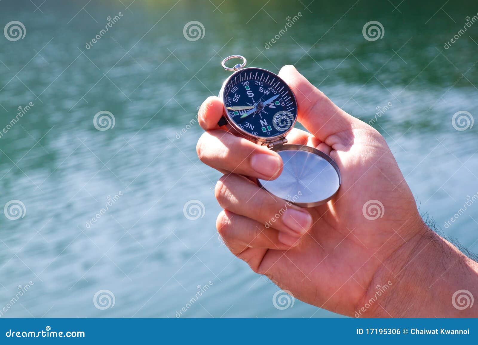 Hand Holding the Black Compass Stock Photo - Image of degree, leader ...