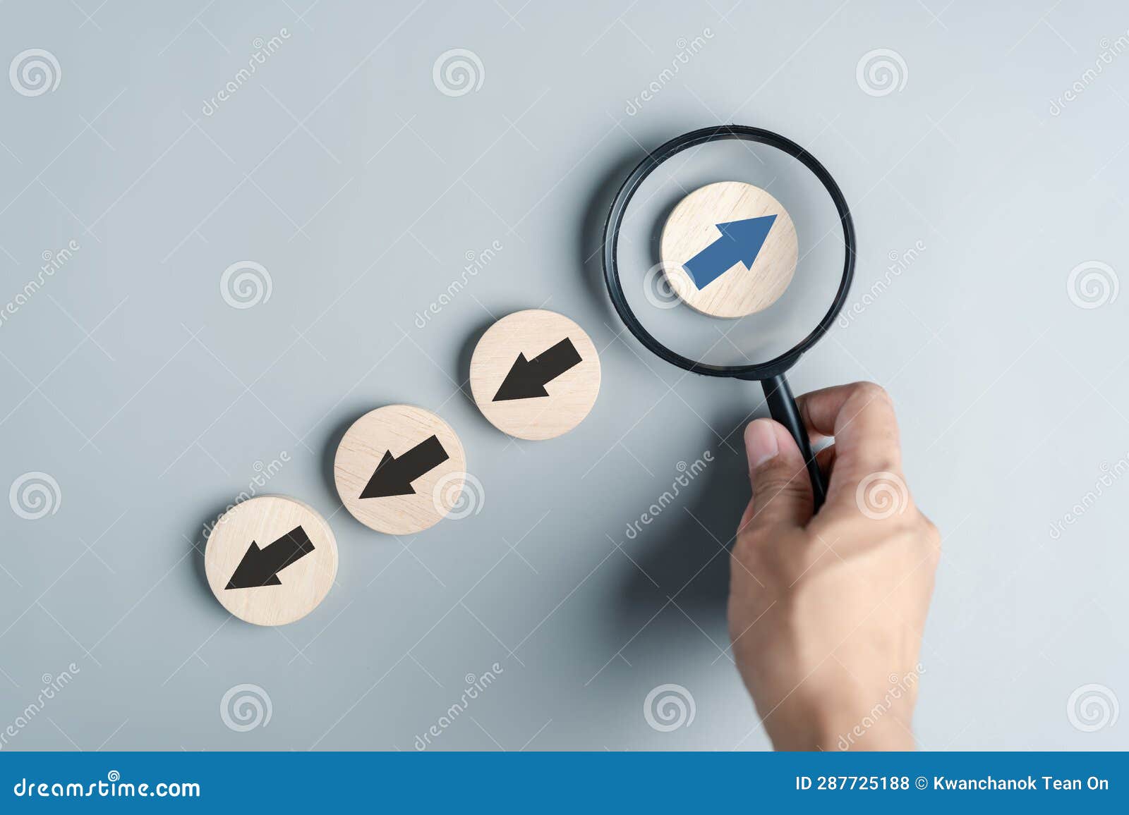 Hand Holding Blue Arrow and Different Direction Facing Opposite ...