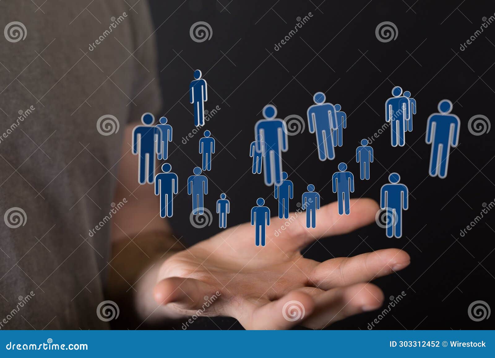 Hand Holding Blue Human Figures Hovering in the Air Stock Photo - Image ...