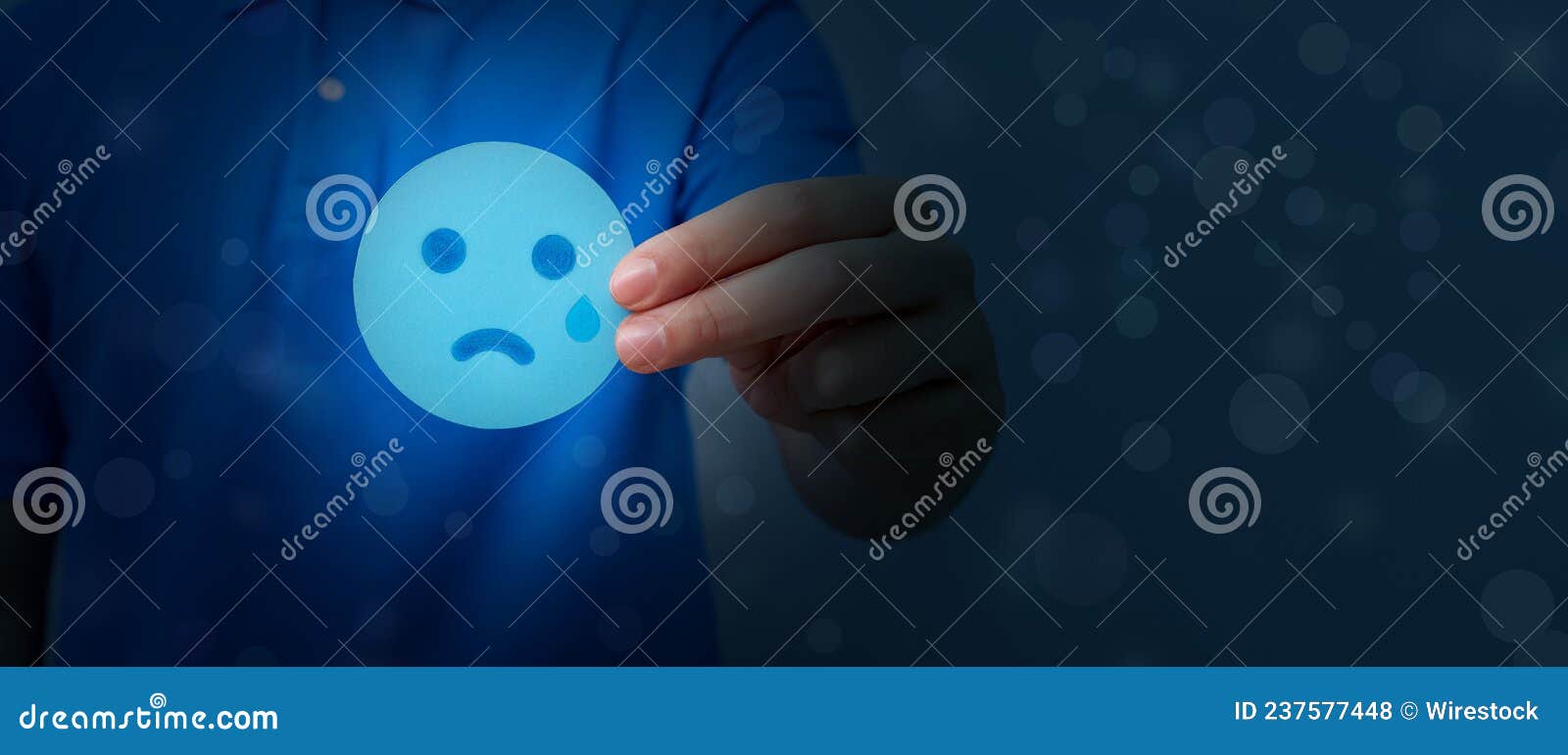 Hand Holding a Blue Sad Face Sign - the Blue Monday Concept Stock Photo ...