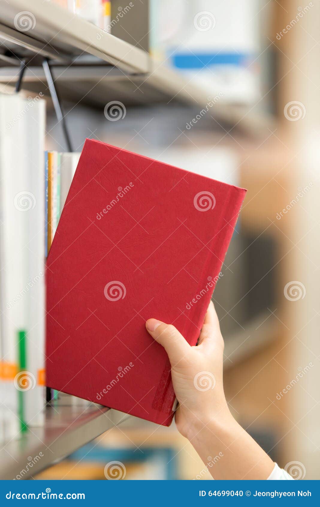 Hand Holding the Book in a Library Stock Photo - Image of notebook ...