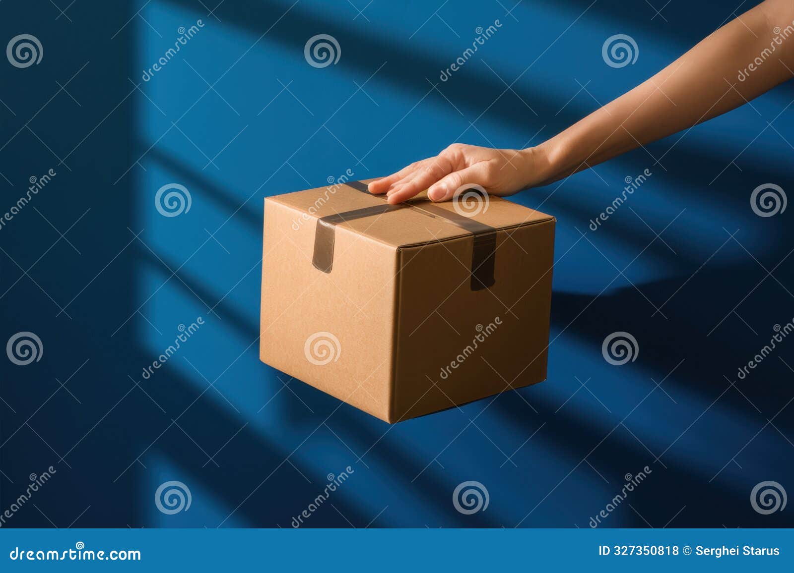 A Hand Holding a Box Against Blue Wall with Striped Background, AI ...