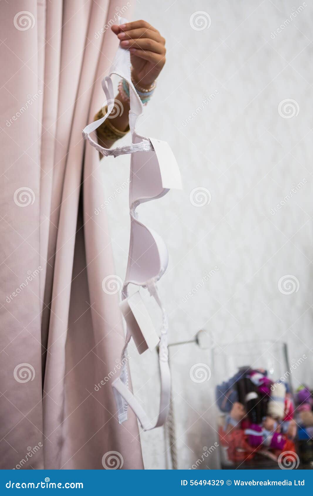 Hand holding a bra stock image. Image of fashion, shopaholic - 56494329