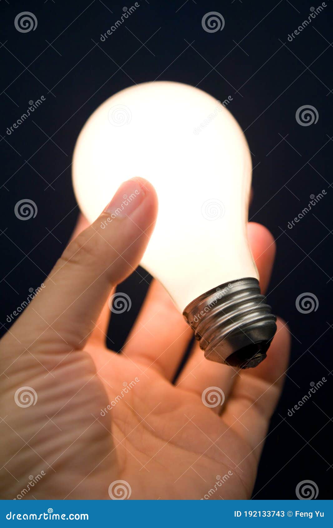 Hand Holding a Bright Light Bulb Stock Image - Image of black ...