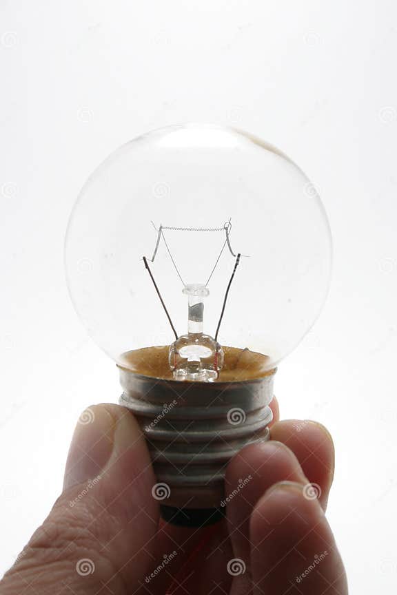 Hand holding bulb stock photo. Image of filament, illuminate - 34878