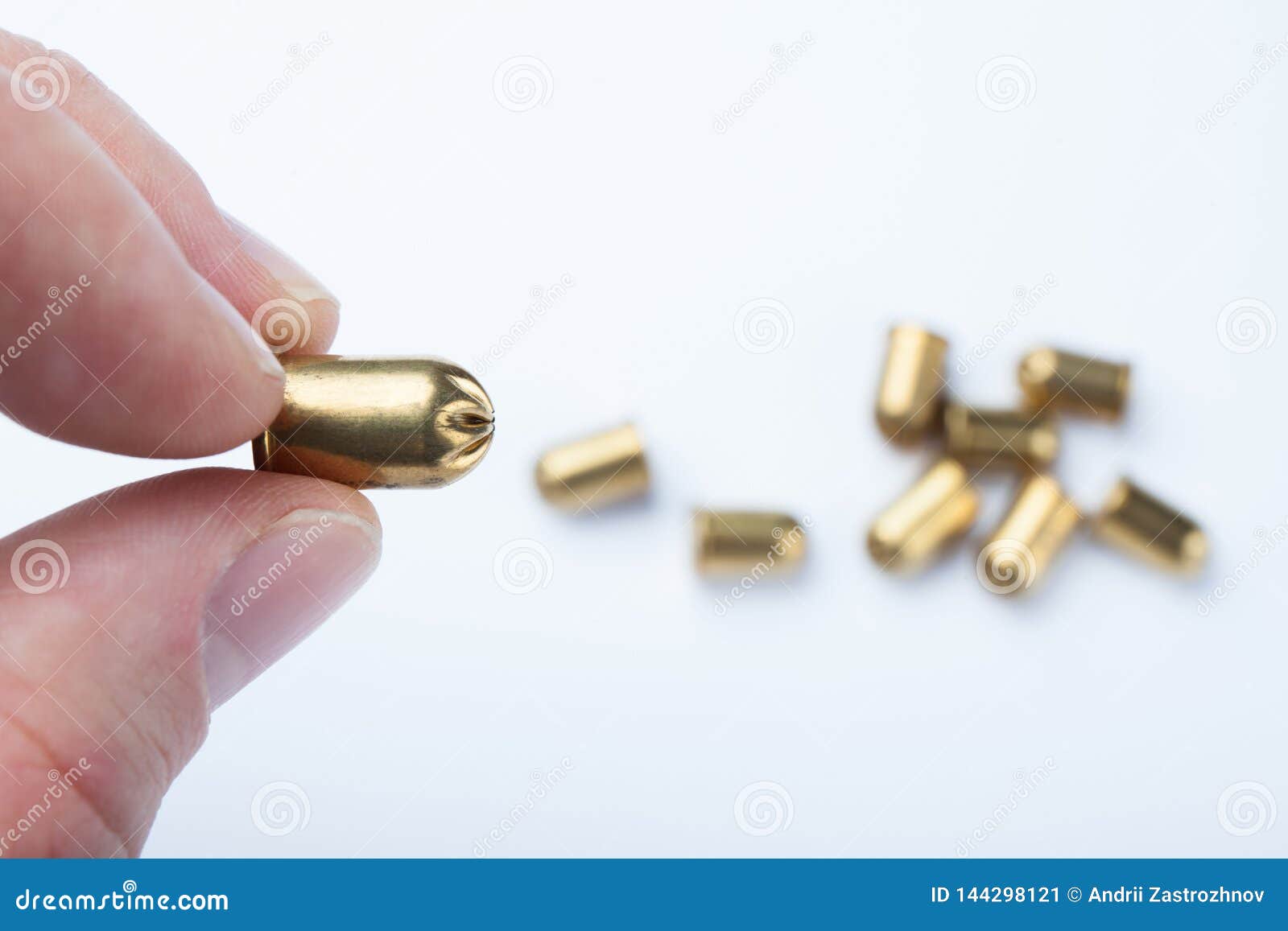 A Hand is Holding a Bullet, Close-up Stock Image - Image of ammo, group ...
