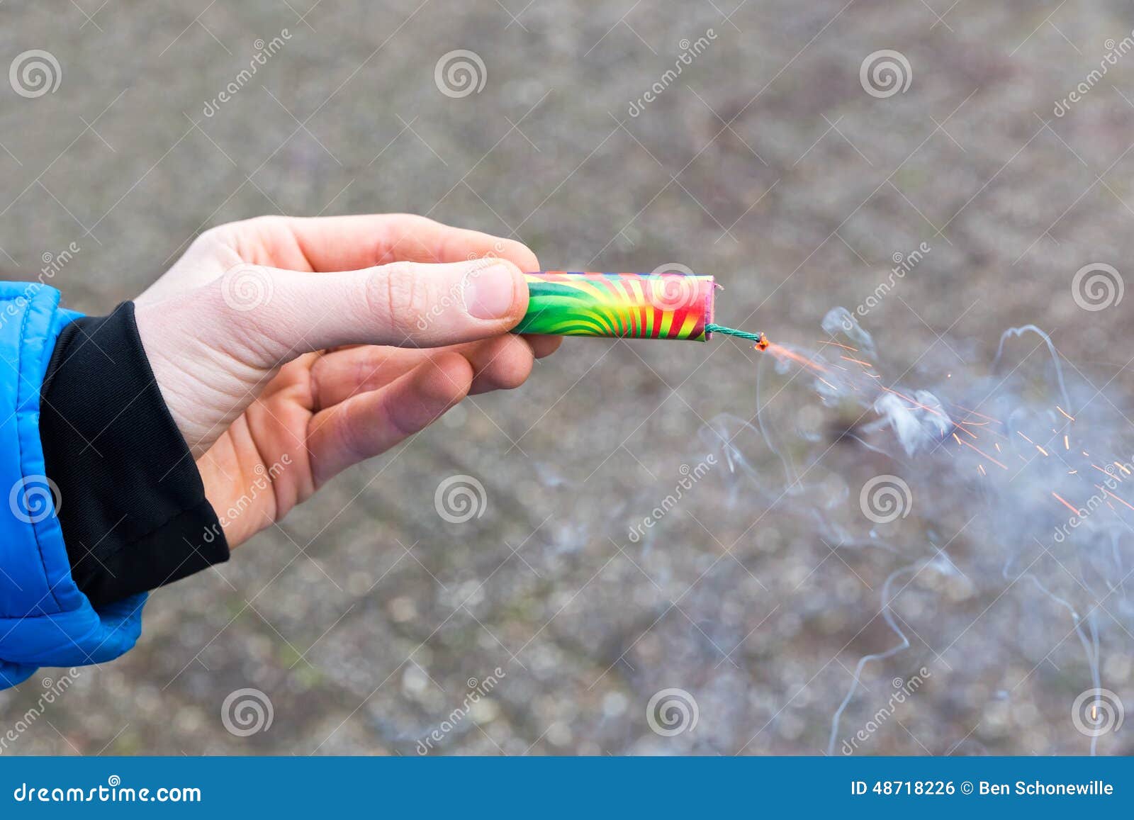 Hand Holding Burning Firework in Street Stock Photo - Image of flour ...