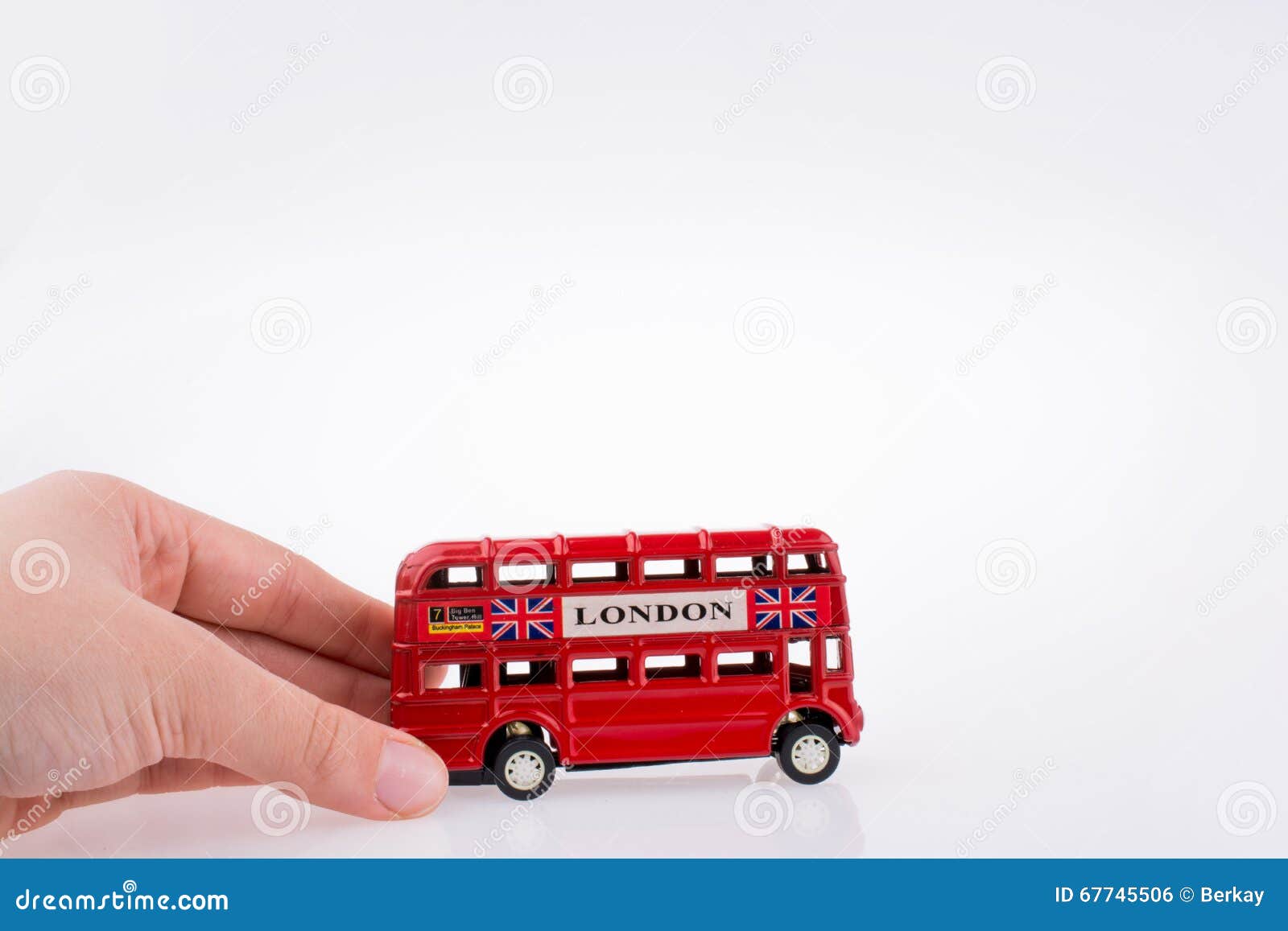 Hand holding a Bus stock photo. Image of iconic, traditional - 67745506