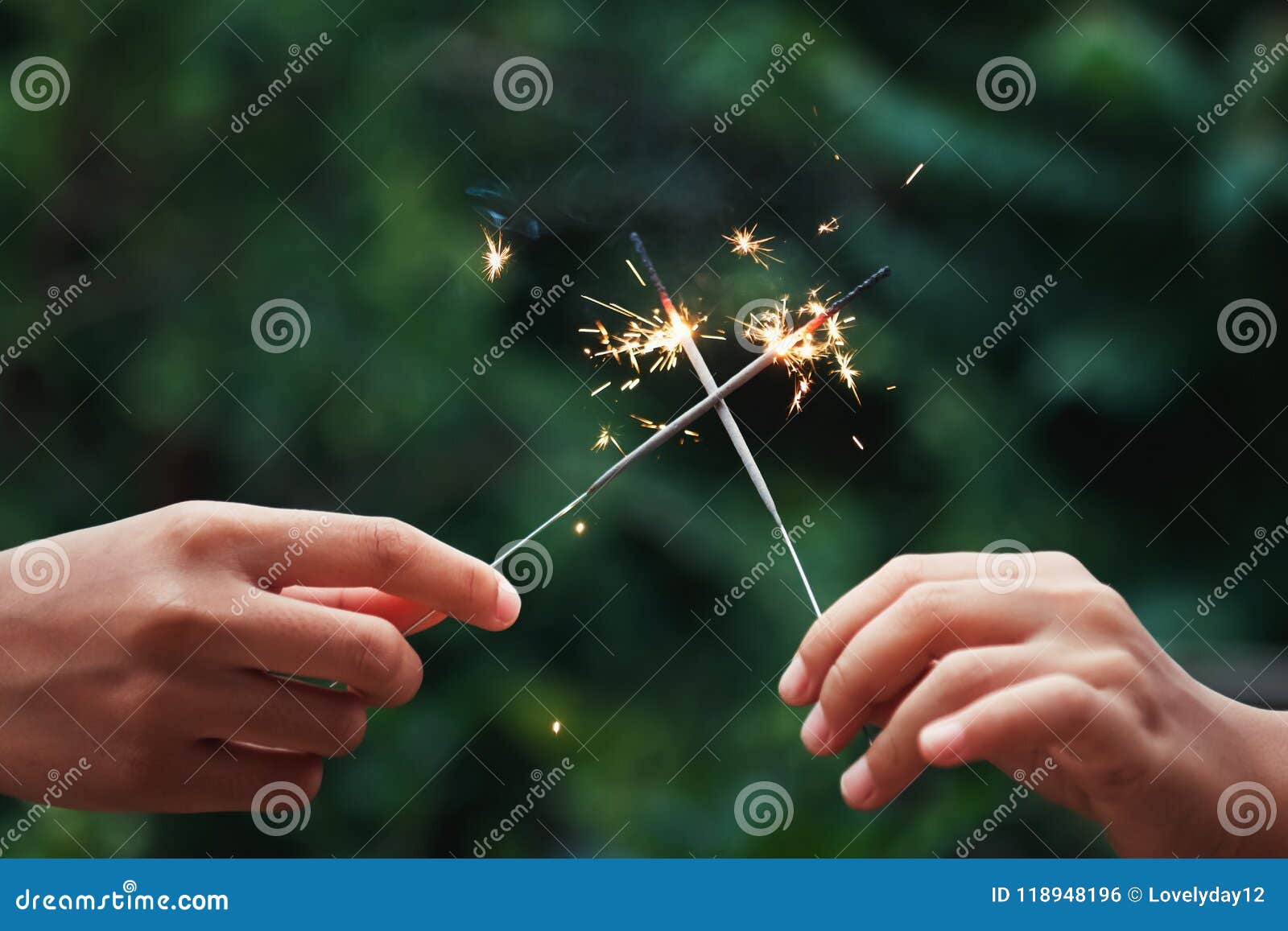 Hand Holding Candle Firework on Green Stock Photo - Image of holding ...
