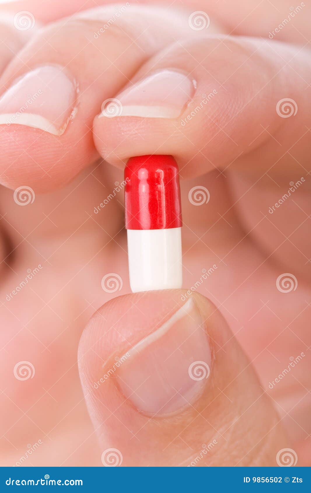 Hand Holding a Capsule or Pill Stock Photo - Image of grab, fingers ...