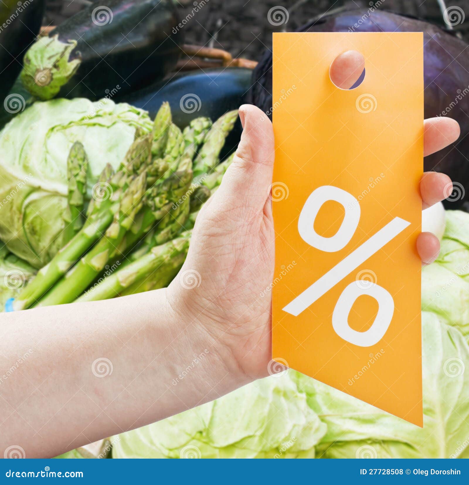 Hand Holding a Card for Discounts Against Products Stock Photo - Image ...