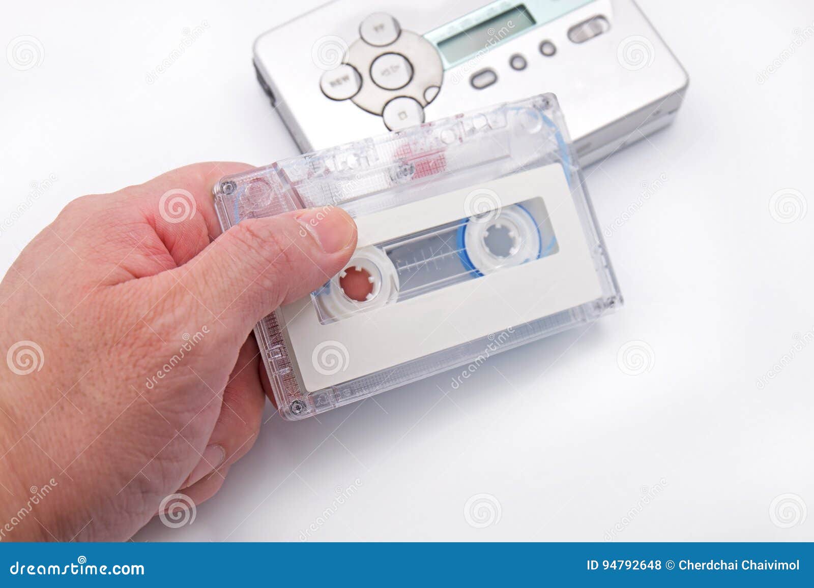 Hand Holding Cassette Tape with Cassette Player Background Stock Photo ...