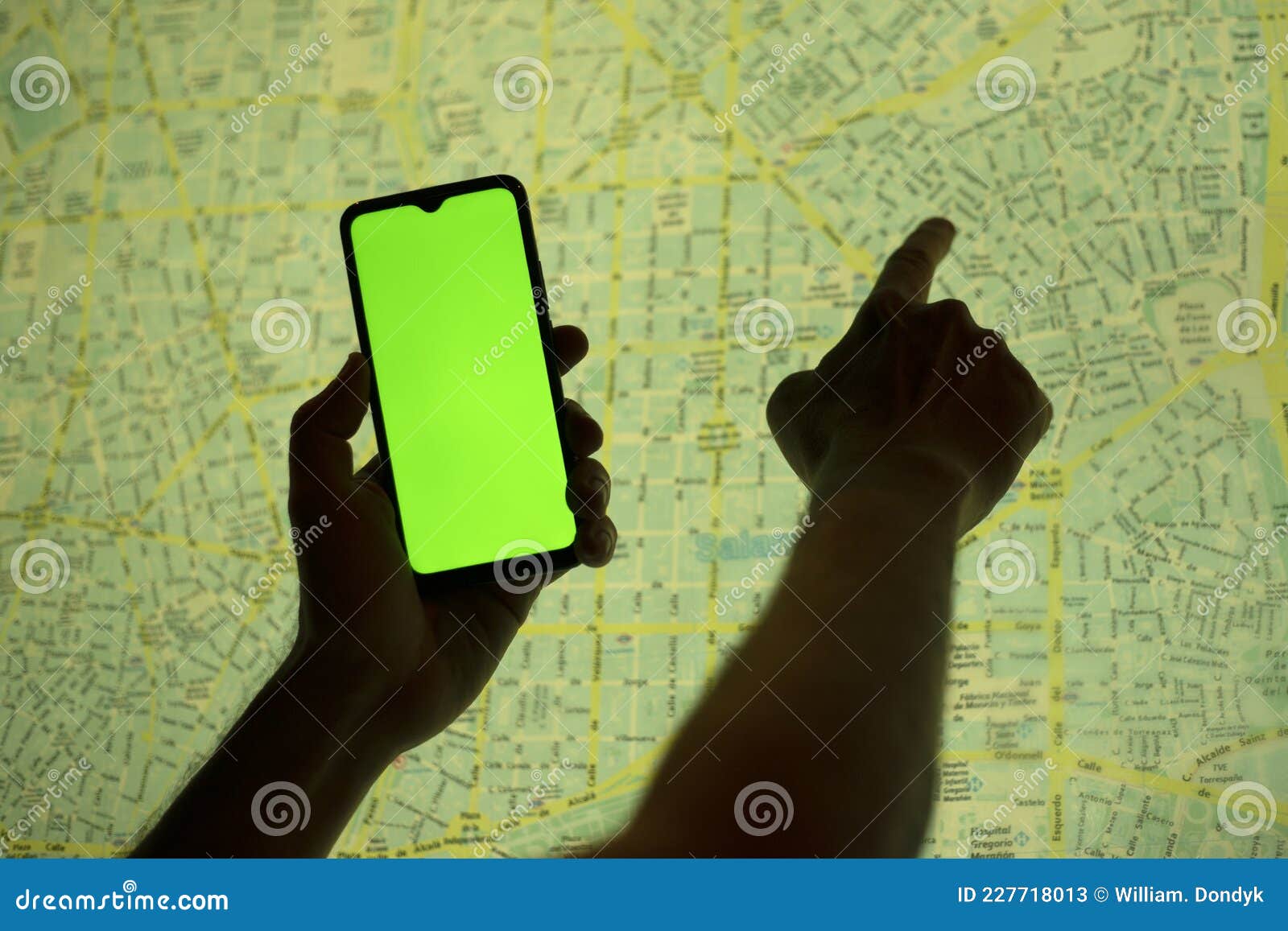 Cell Phone with the Screen on Camera and the Other Hand Pointing To a ...