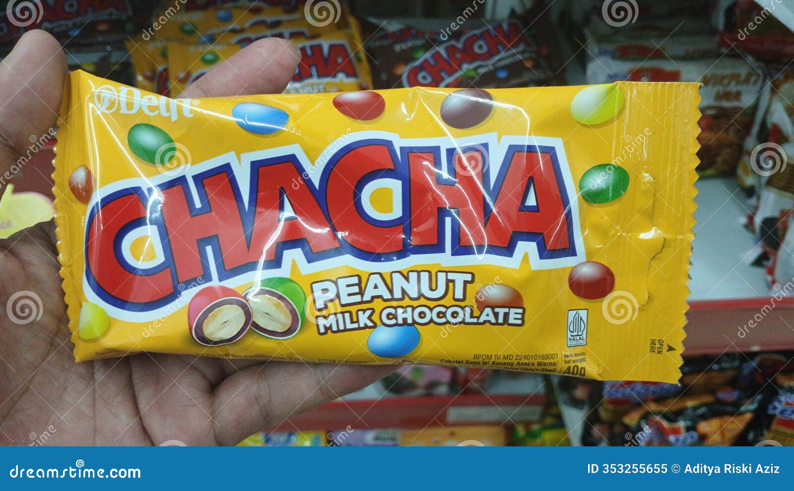 Hand Holding Cha Cha Snack. Cha Cha is Peanut with Milk Chocolate Which ...
