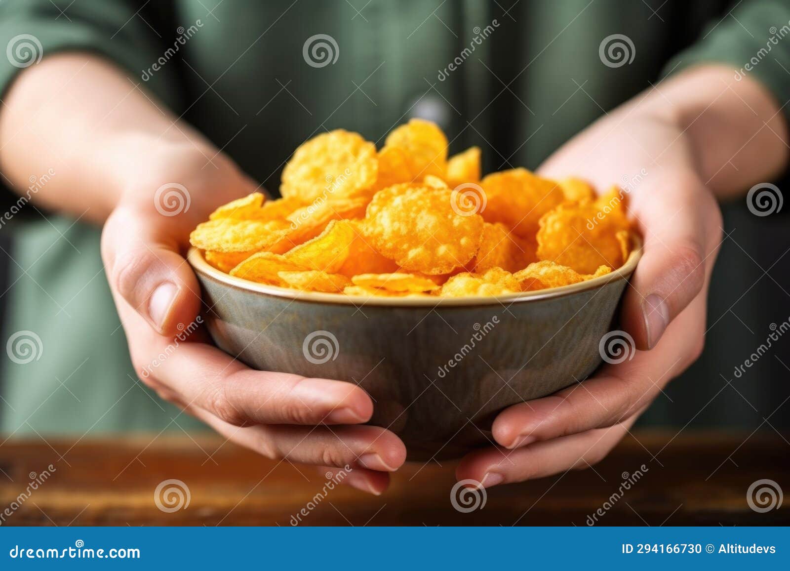 Hand Holding Cheese Puffs Over a Bowl Stock Photo - Image of finger ...