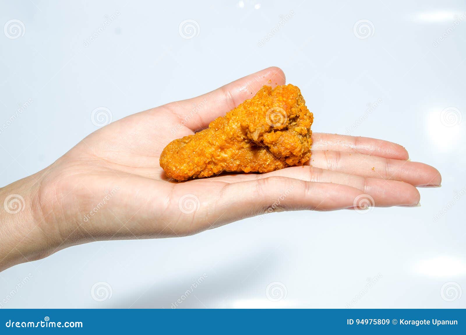 Hand holding Chicken Wing stock image. Image of cooked - 94975809