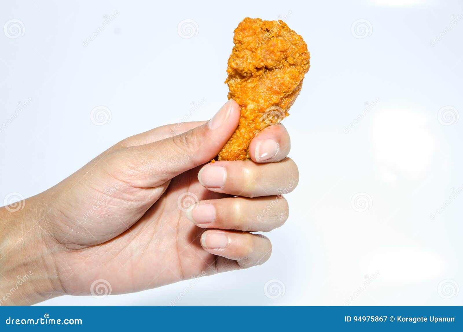 Hand holding Chicken Wing stock image. Image of powder - 94975867