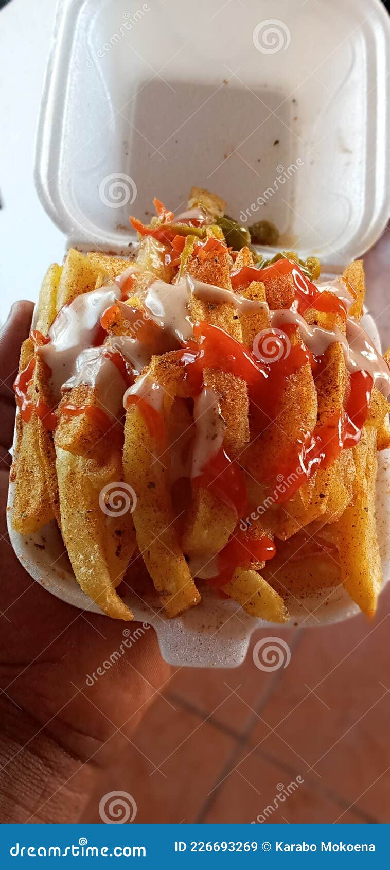 A hand holding chips stock image. Image of holding, food - 226693269