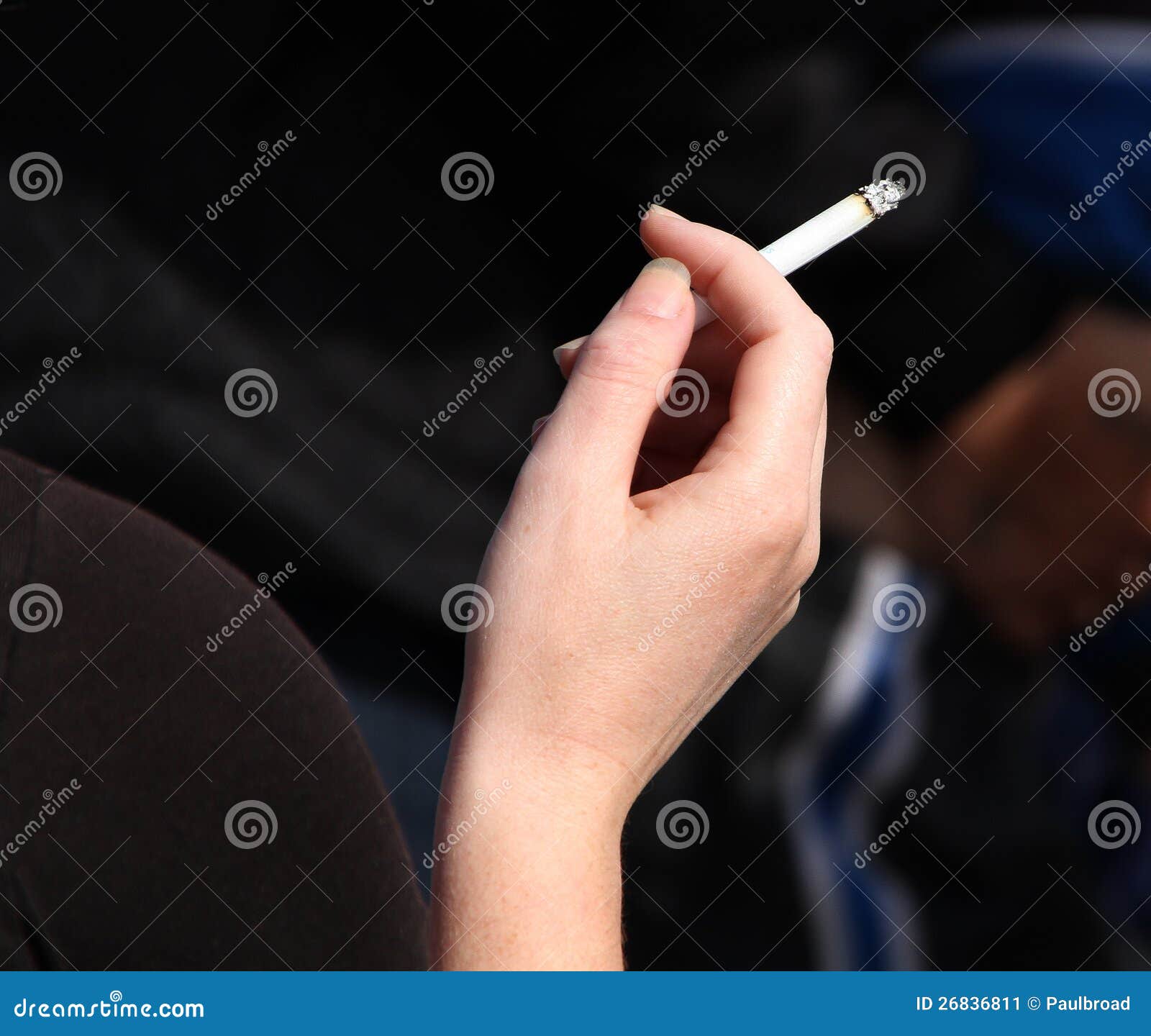 Hand holding cigarette. stock image. Image of female - 26836811