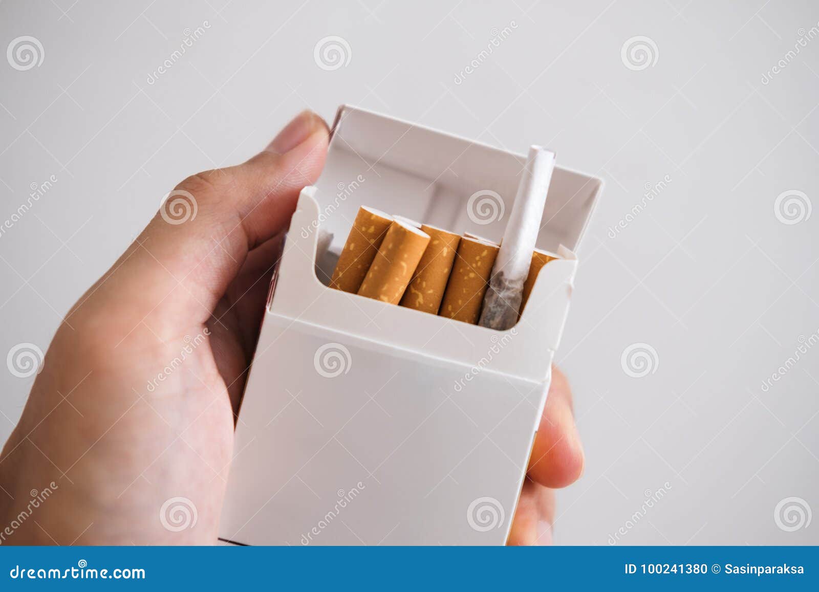 Hand Holding Cigarette Box with Hiding Marijuana Rolled Joint Inside ...